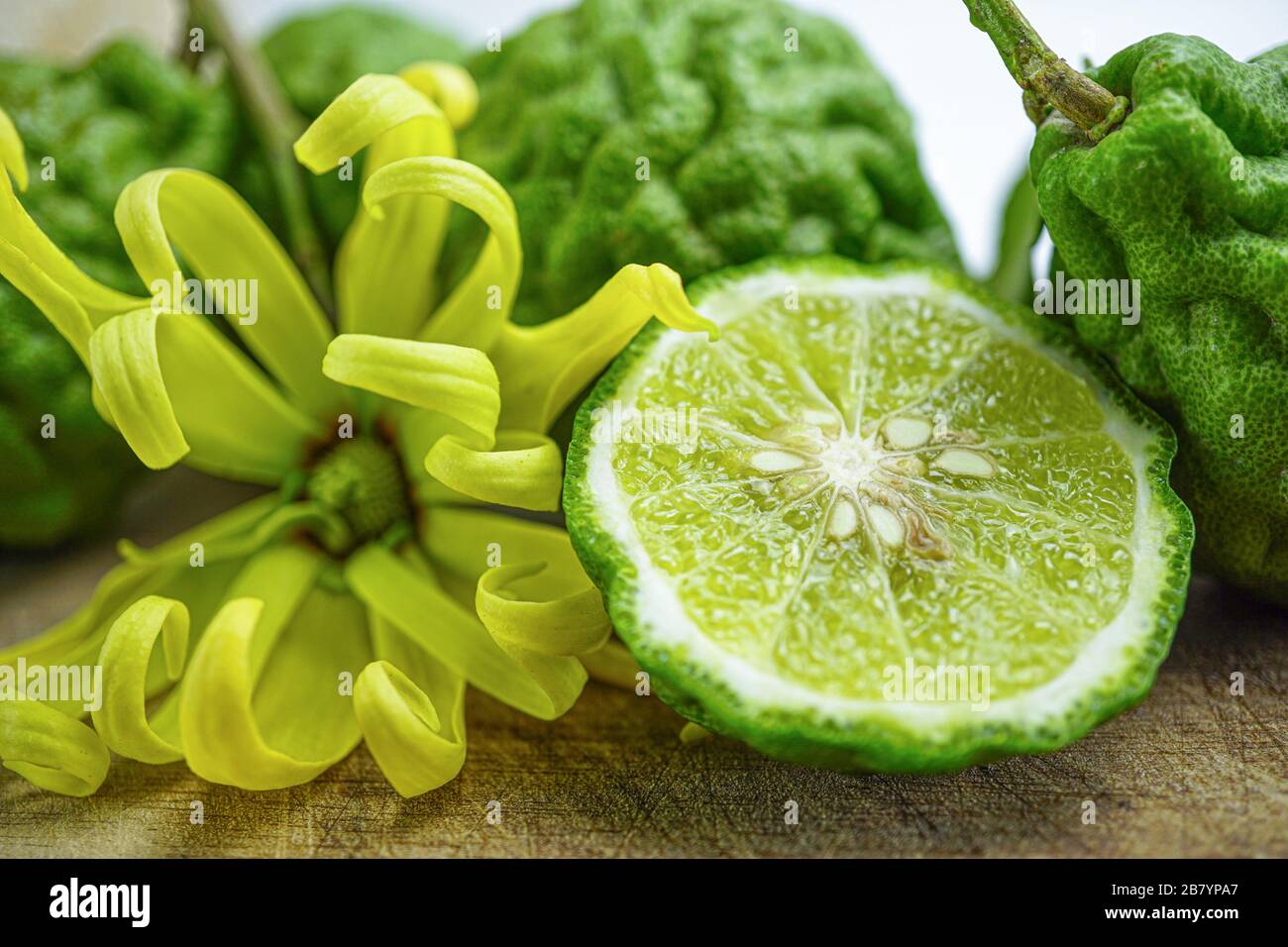 Bergamot fresh fruit on wooden background with yellow flower : natural ...