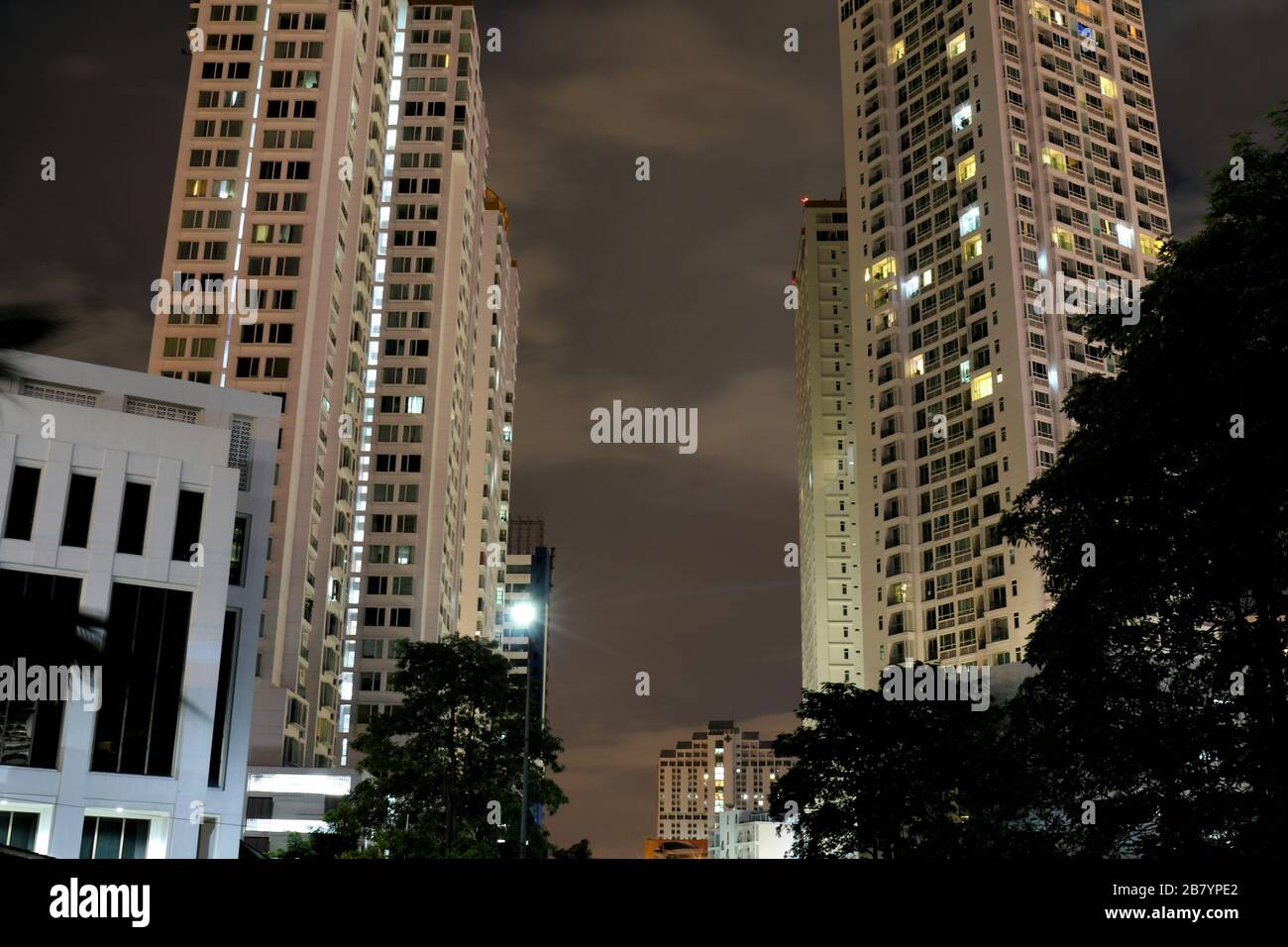 residential buildings twins at night view Stock Photo - Alamy