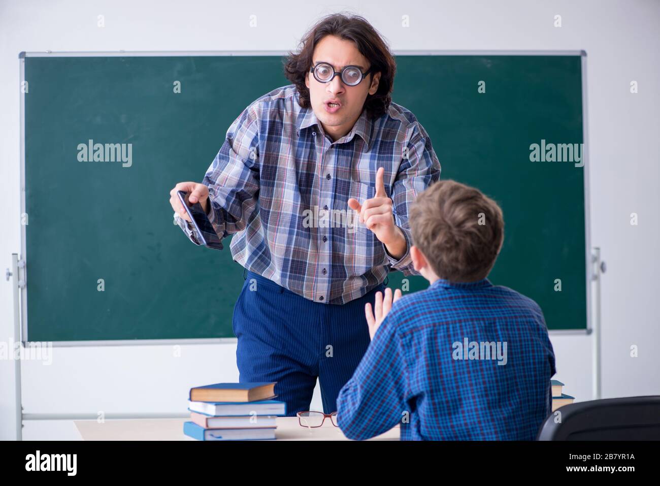Student using mobile during class hi-res stock photography and images ...