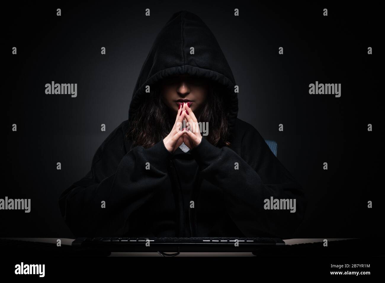 The female hacker hacking security firewall late in office Stock Photo ...