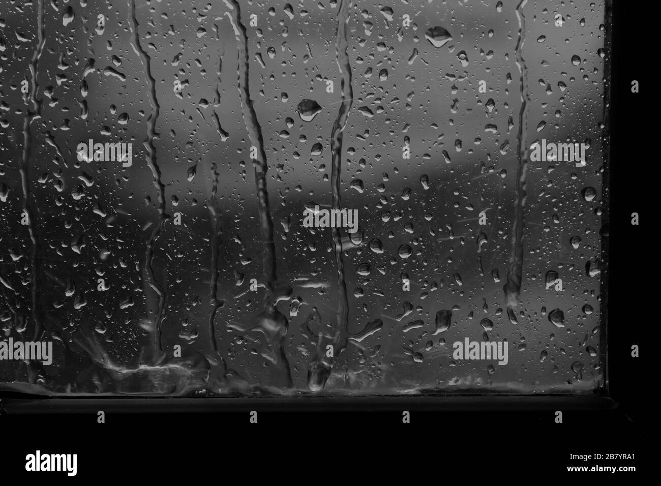 background dark raindrop on window glass gray Stock Photo - Alamy
