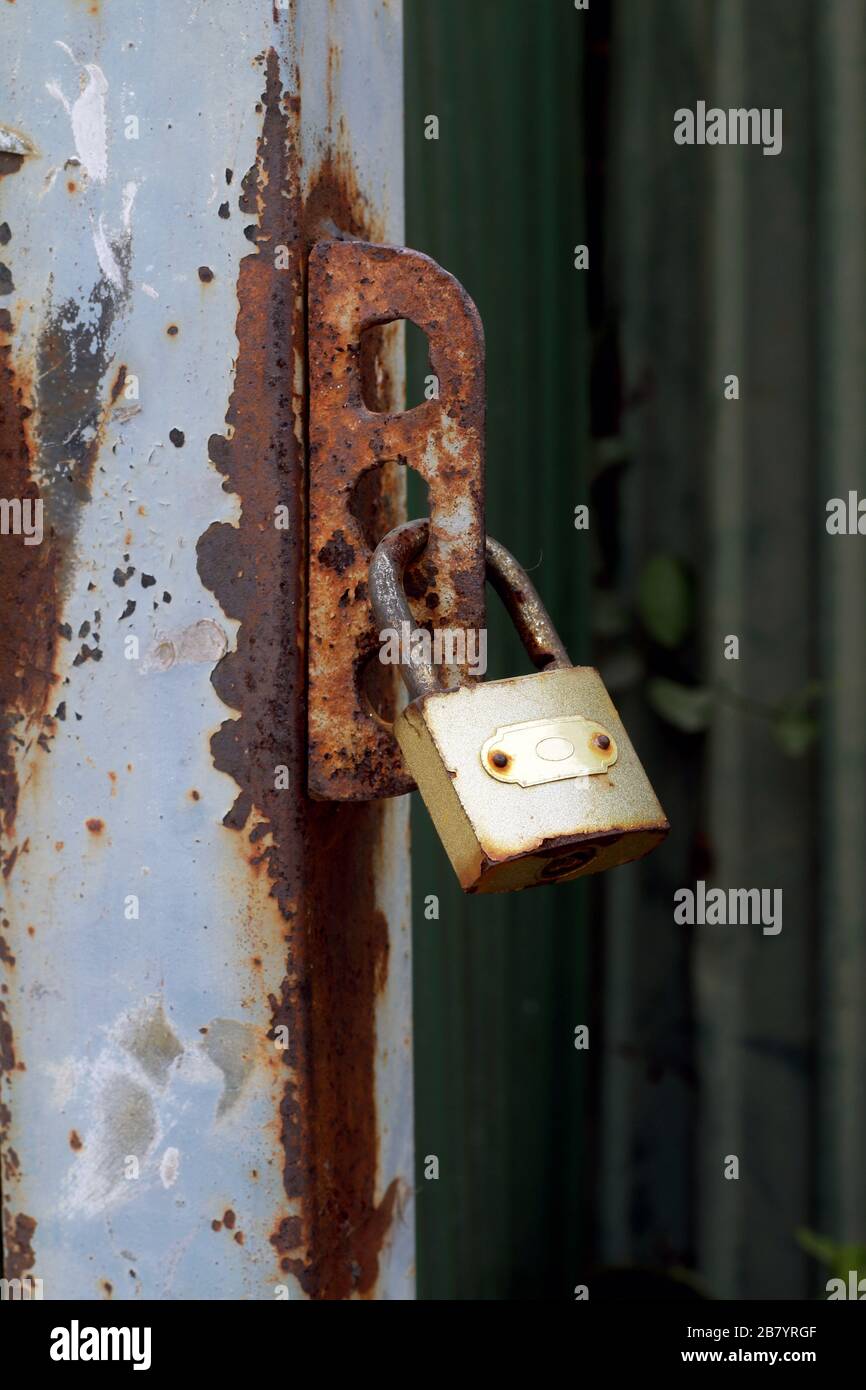 old key lock on the metal fence Stock Photo - Alamy