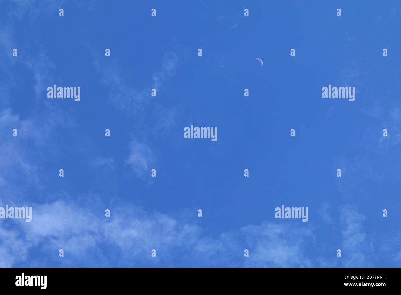 Beautiful blue and small moon on sky with clouds for background and ...