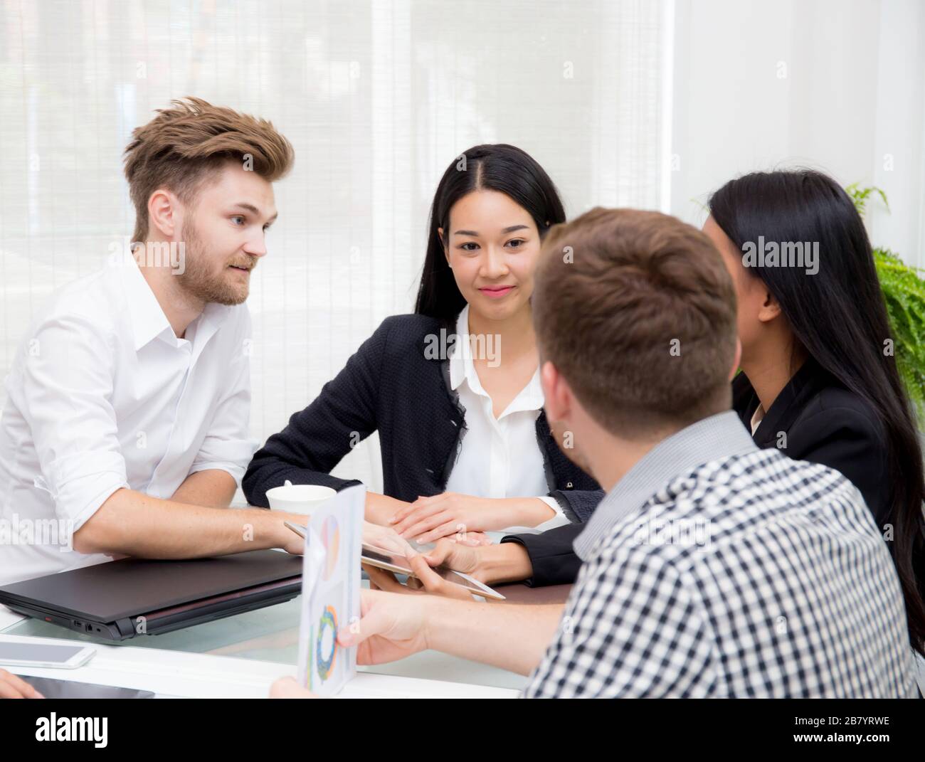 Group of business people brainstorming together in the meeting room ...