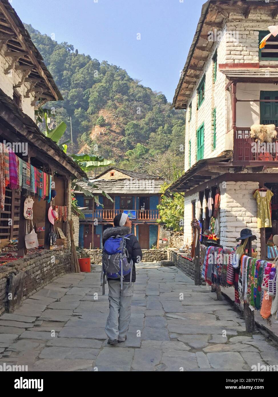 Woman hiking through villages in Ulleri Pokhara in Nepal Stock Photo ...