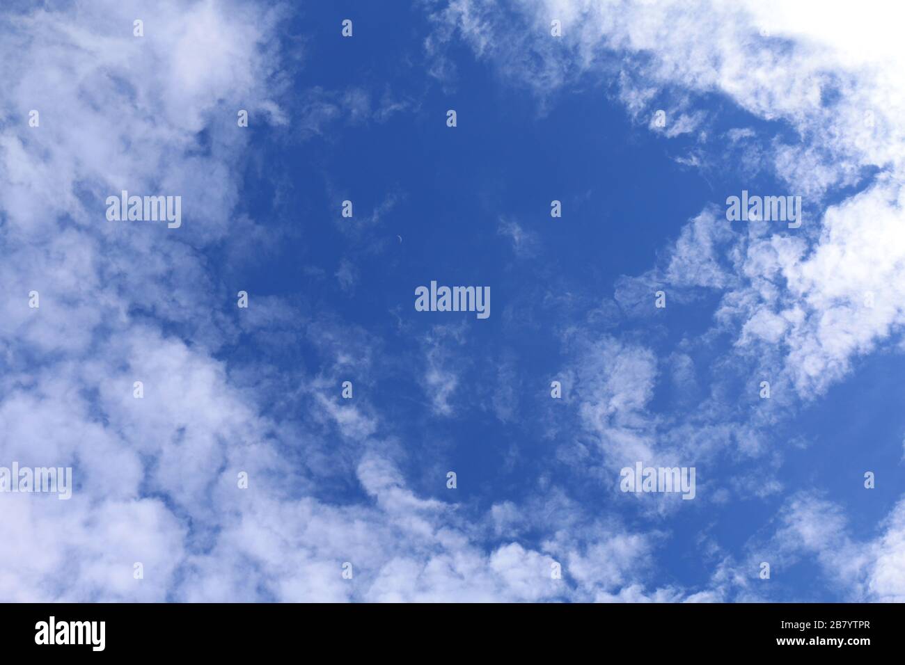 Beautiful blue and small moon on sky with clouds for background and ...