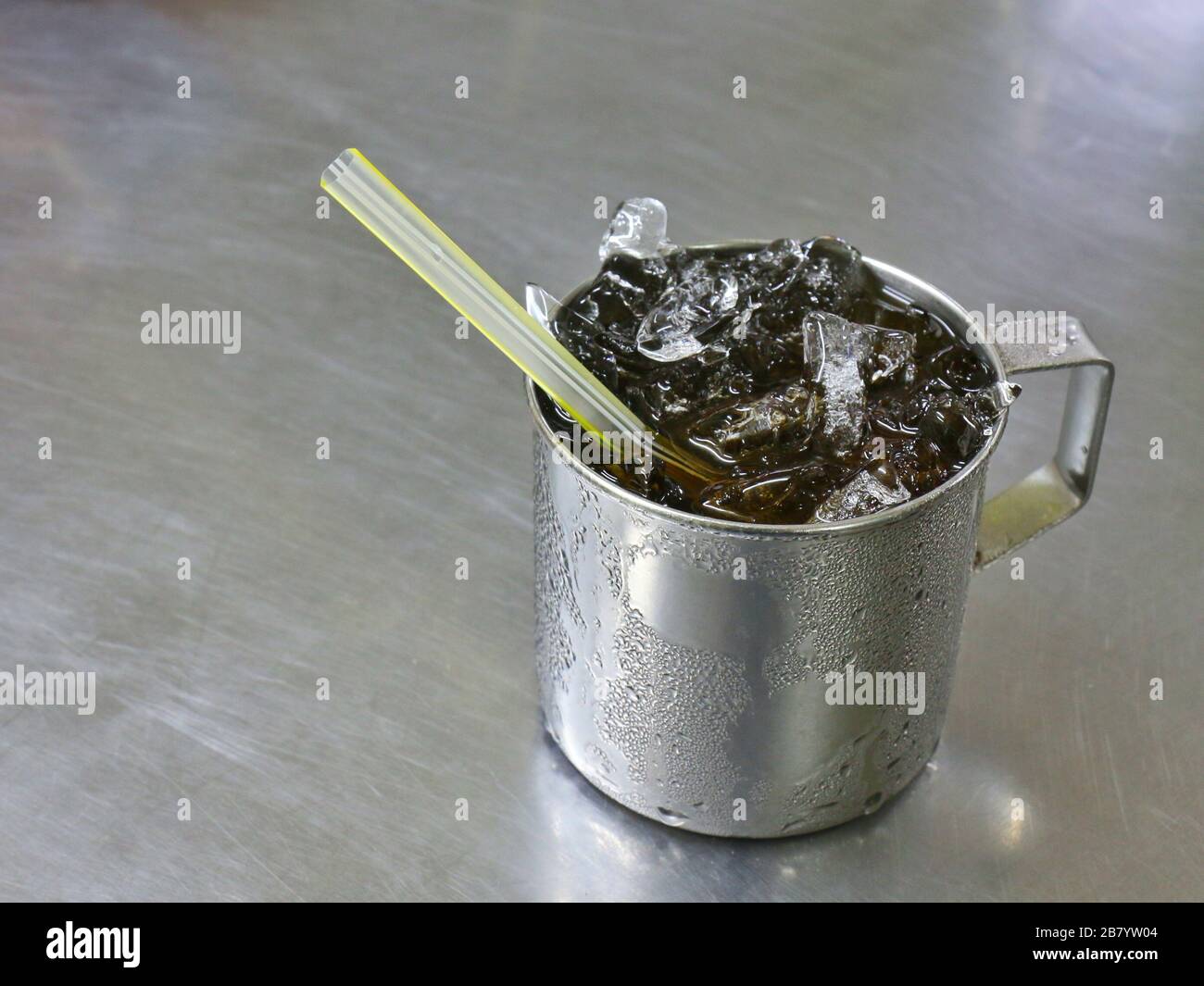 Glass, stainless steel ice water drink Stock Photo - Alamy