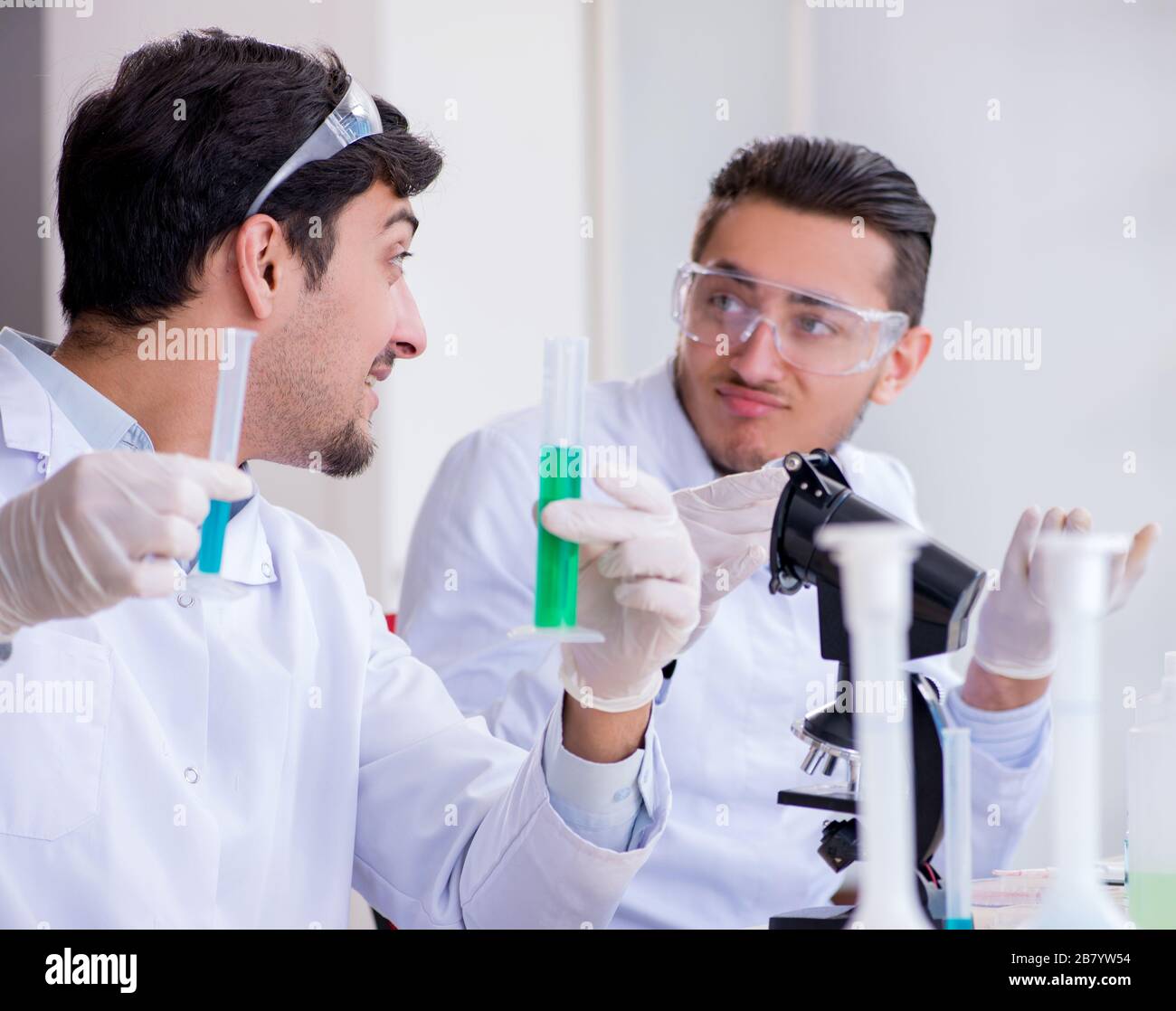 The team of chemists working in the lab Stock Photo - Alamy