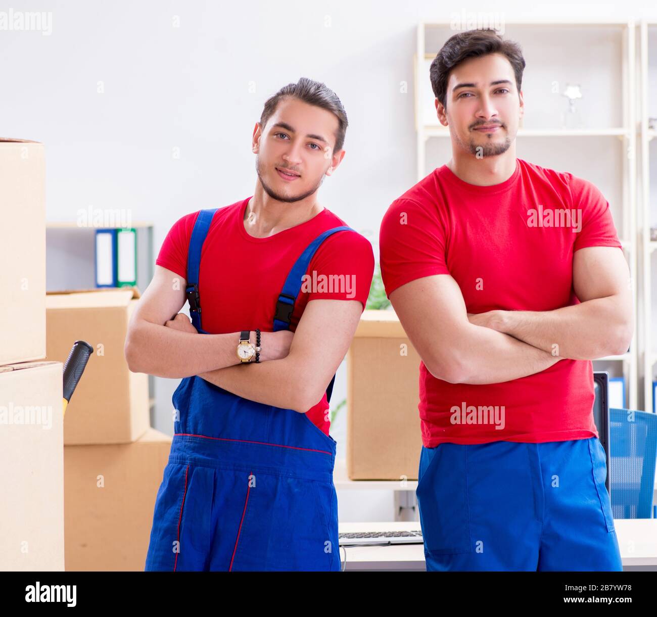 The two contractor employees moving personal belongings Stock Photo - Alamy