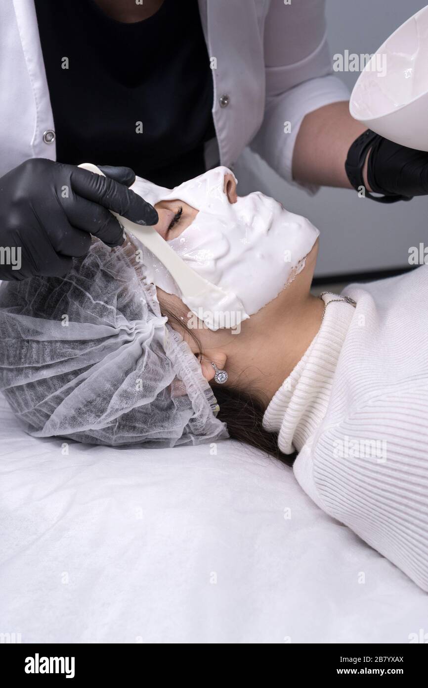 Woman applying alginate mask in hi-res stock photography and images - Alamy