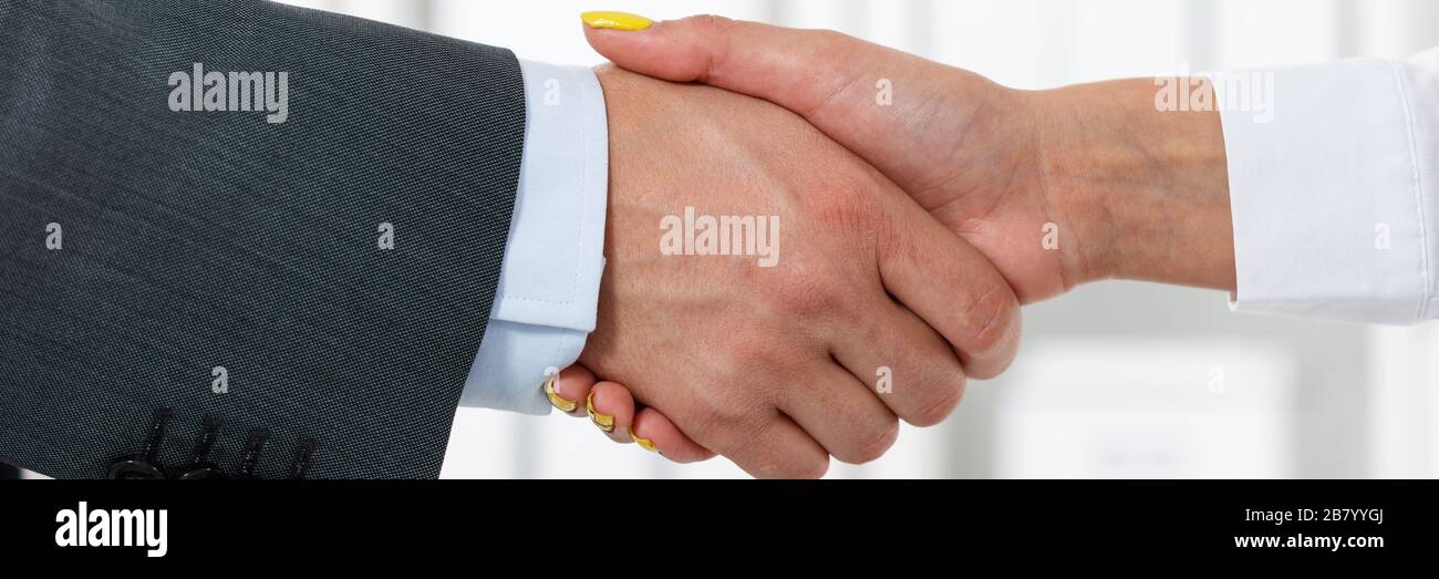 Male and female handshake in office Stock Photo - Alamy