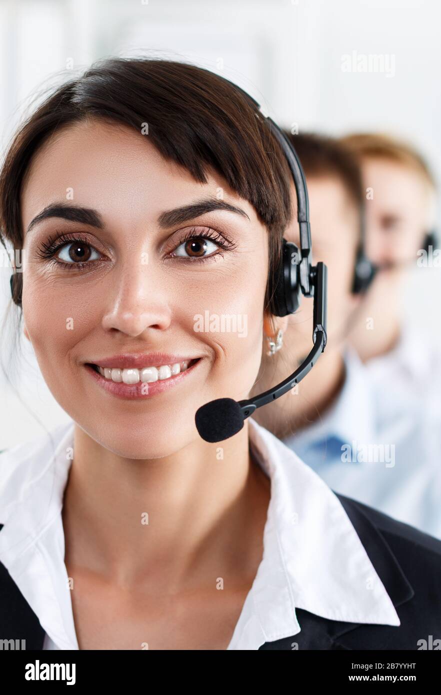 Three call center service operators at work Stock Photo - Alamy