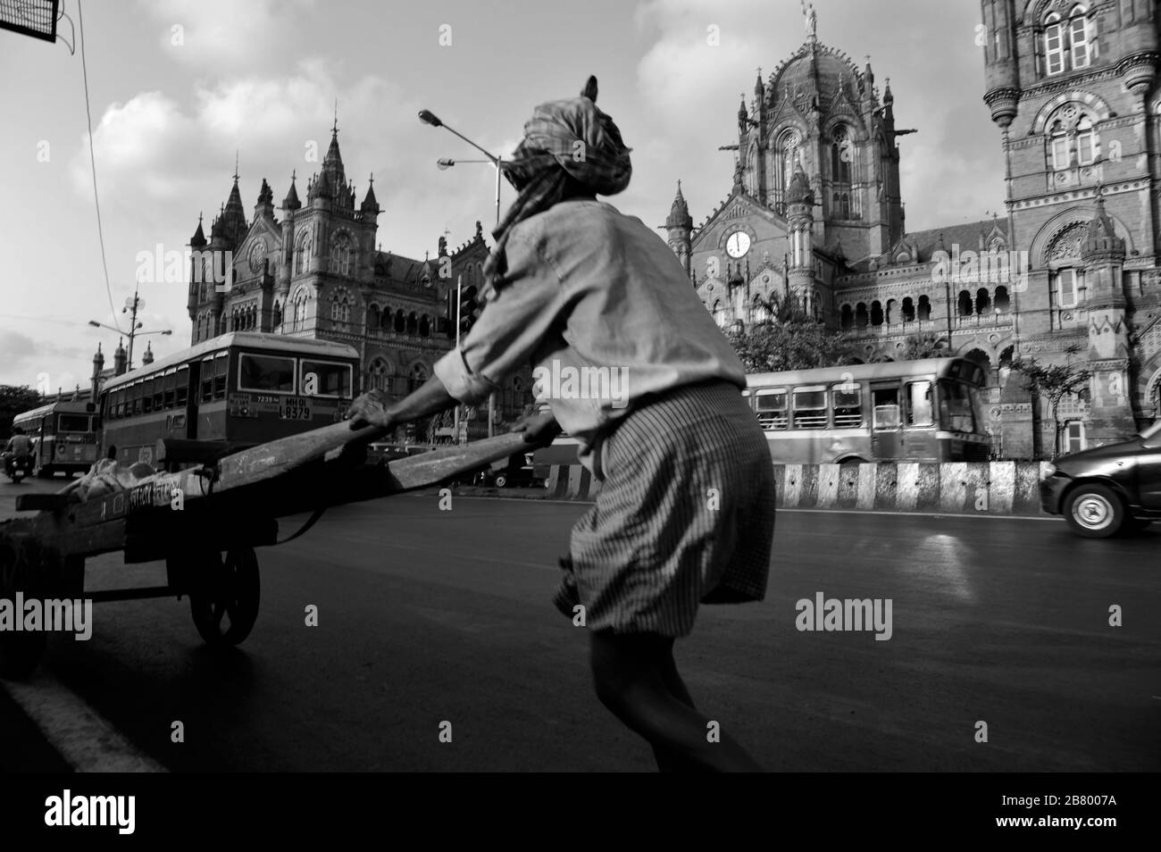 Indian men pushing bus Black and White Stock Photos & Images - Alamy