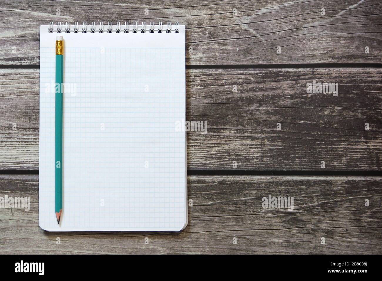 Notepad with a blank white sheet in a checker paper with simple ...