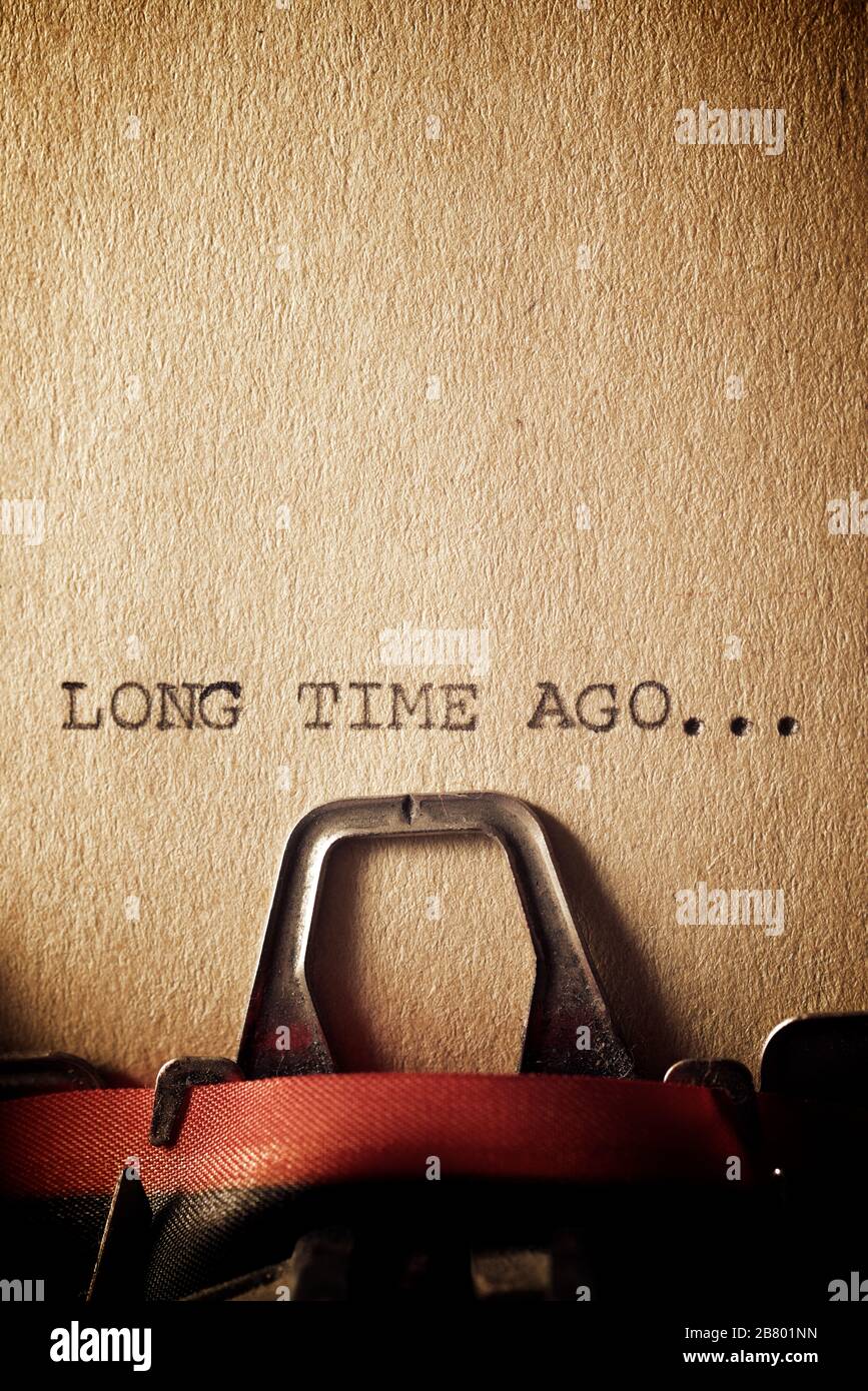 The sentence, Long Time Ago, written with a typewriter Stock Photo - Alamy