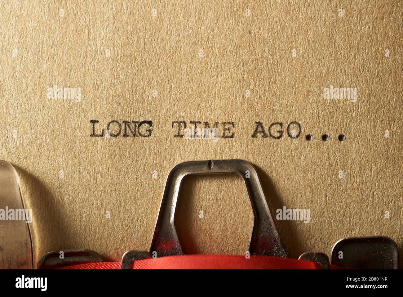 The sentence, Long Time Ago, written with a typewriter Stock Photo - Alamy