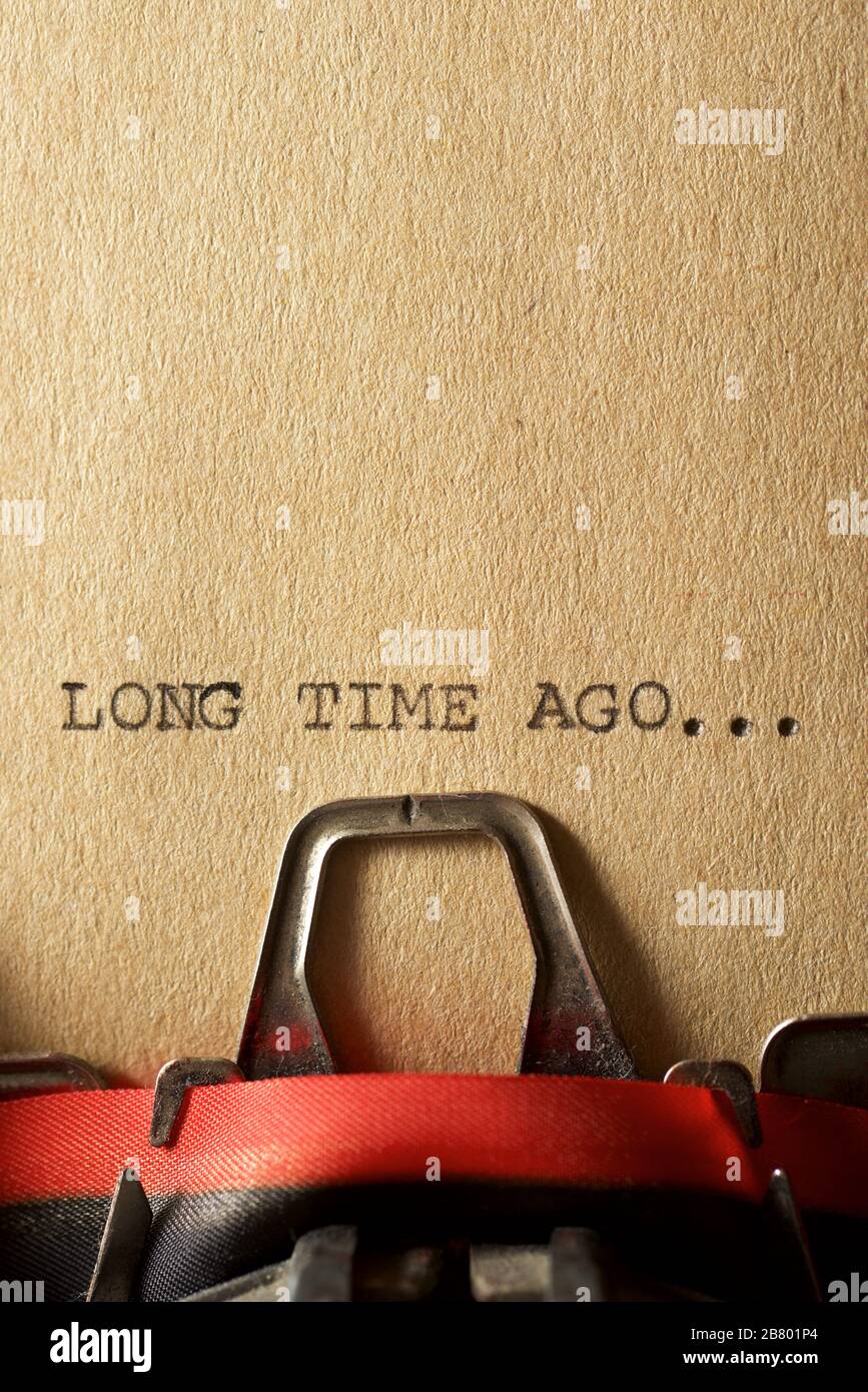 The sentence, Long Time Ago, written with a typewriter Stock Photo - Alamy