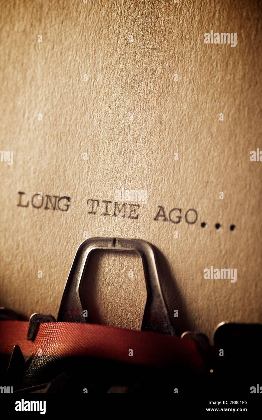 The sentence, Long Time Ago, written with a typewriter Stock Photo - Alamy