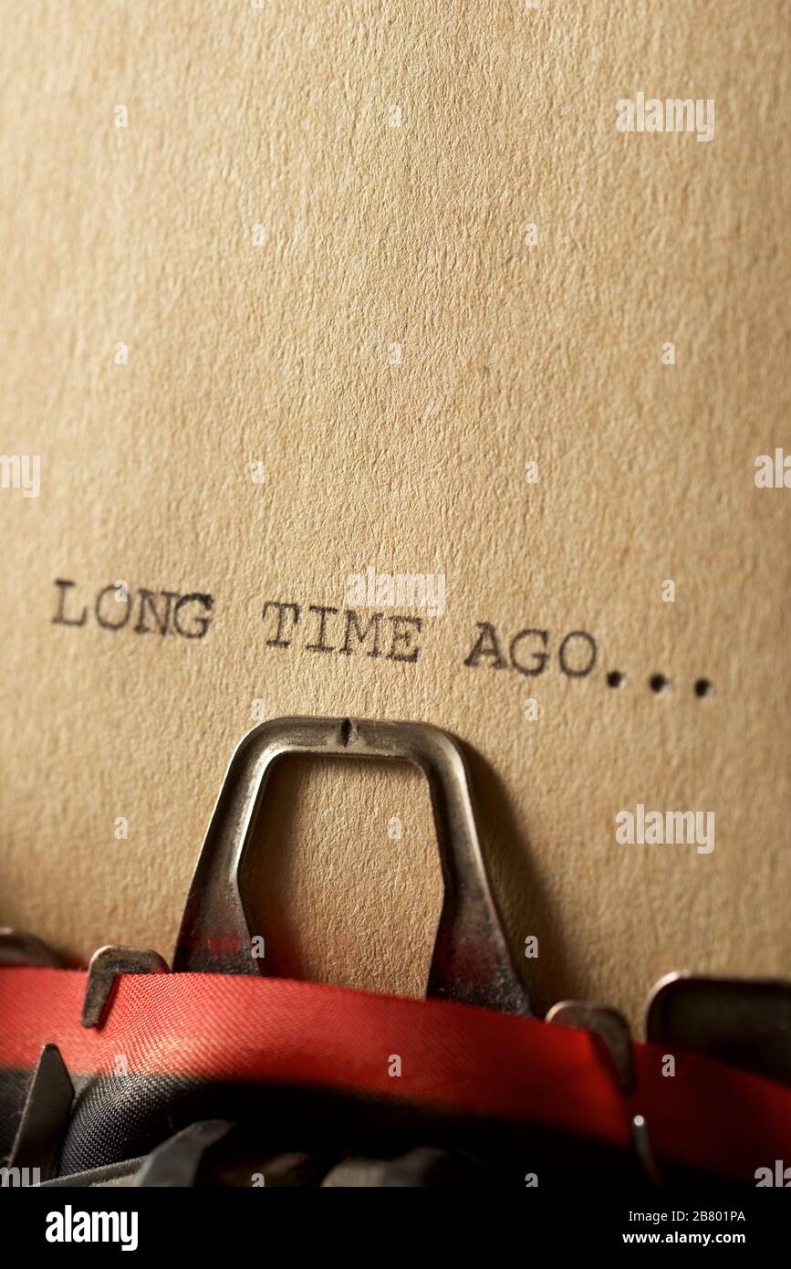 The sentence, Long Time Ago, written with a typewriter Stock Photo - Alamy