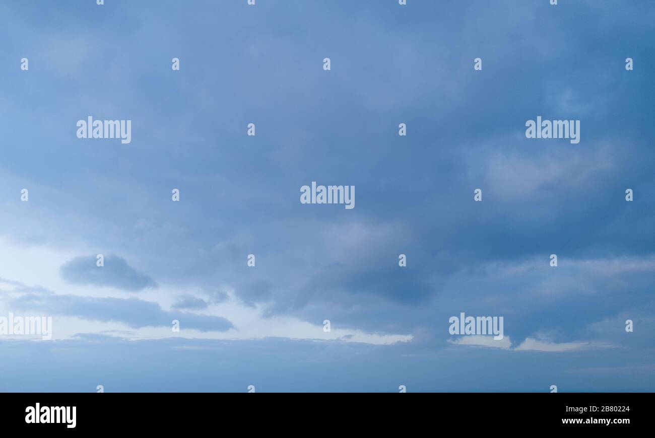 Beautiful sky with stretched clouds during twilight Stock Photo - Alamy