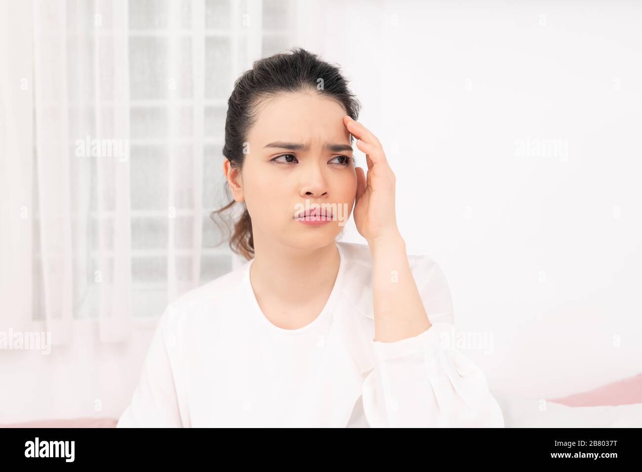 Woman unwell on bed hi-res stock photography and images - Alamy