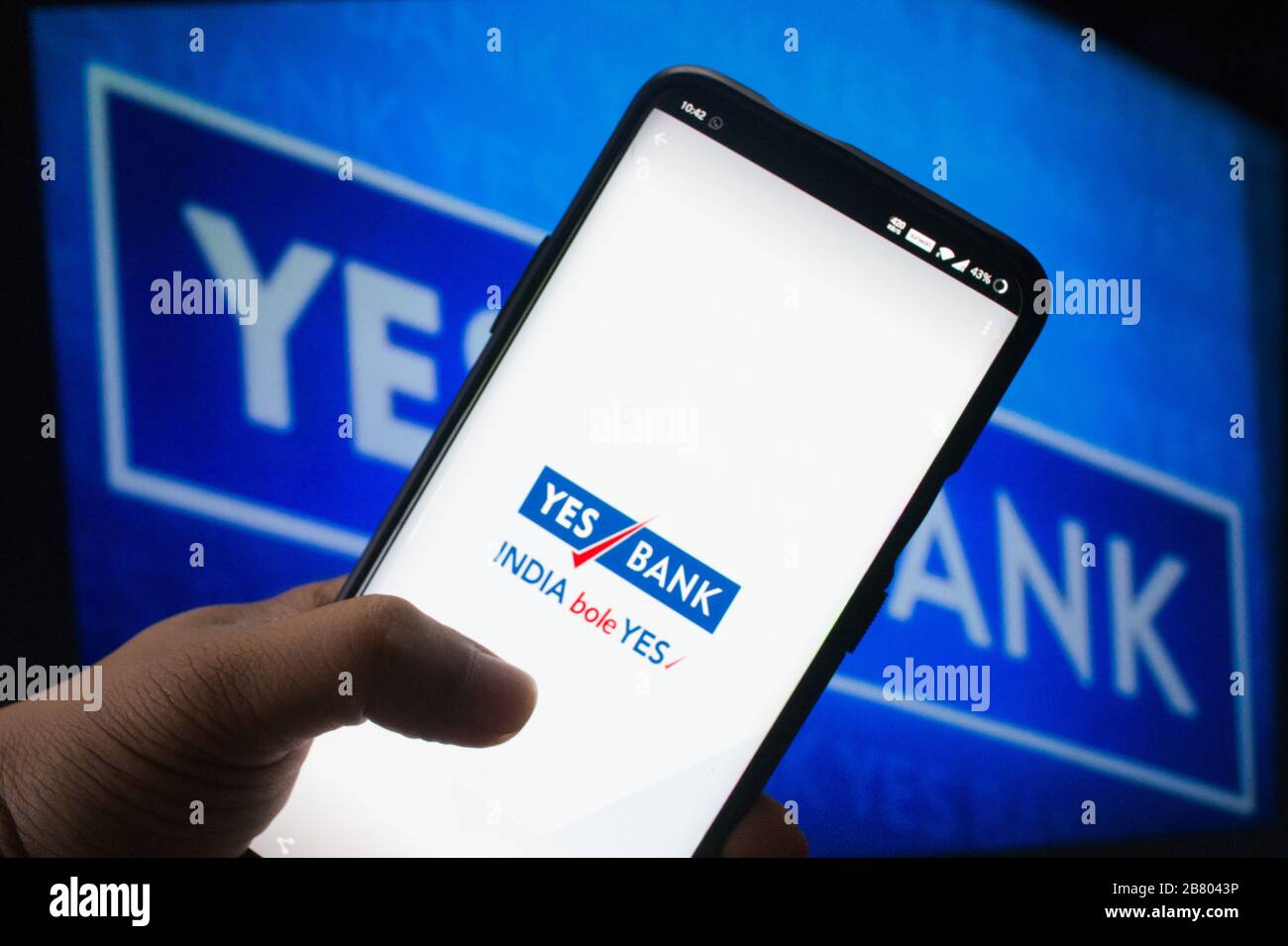 A mobile logged into the yes bank mobile application infront of the yes ...