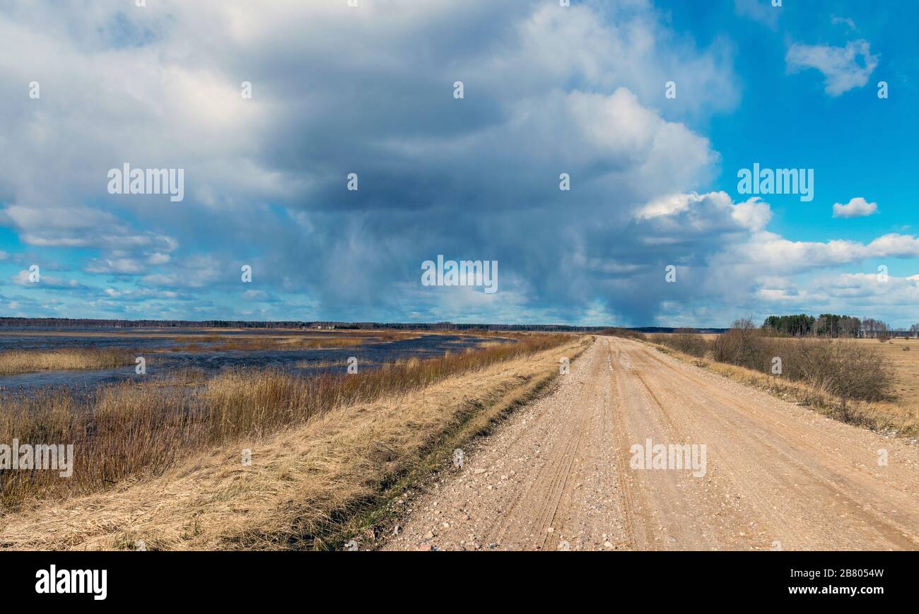 landscape with a simple country road, sunny spring day Stock Photo - Alamy