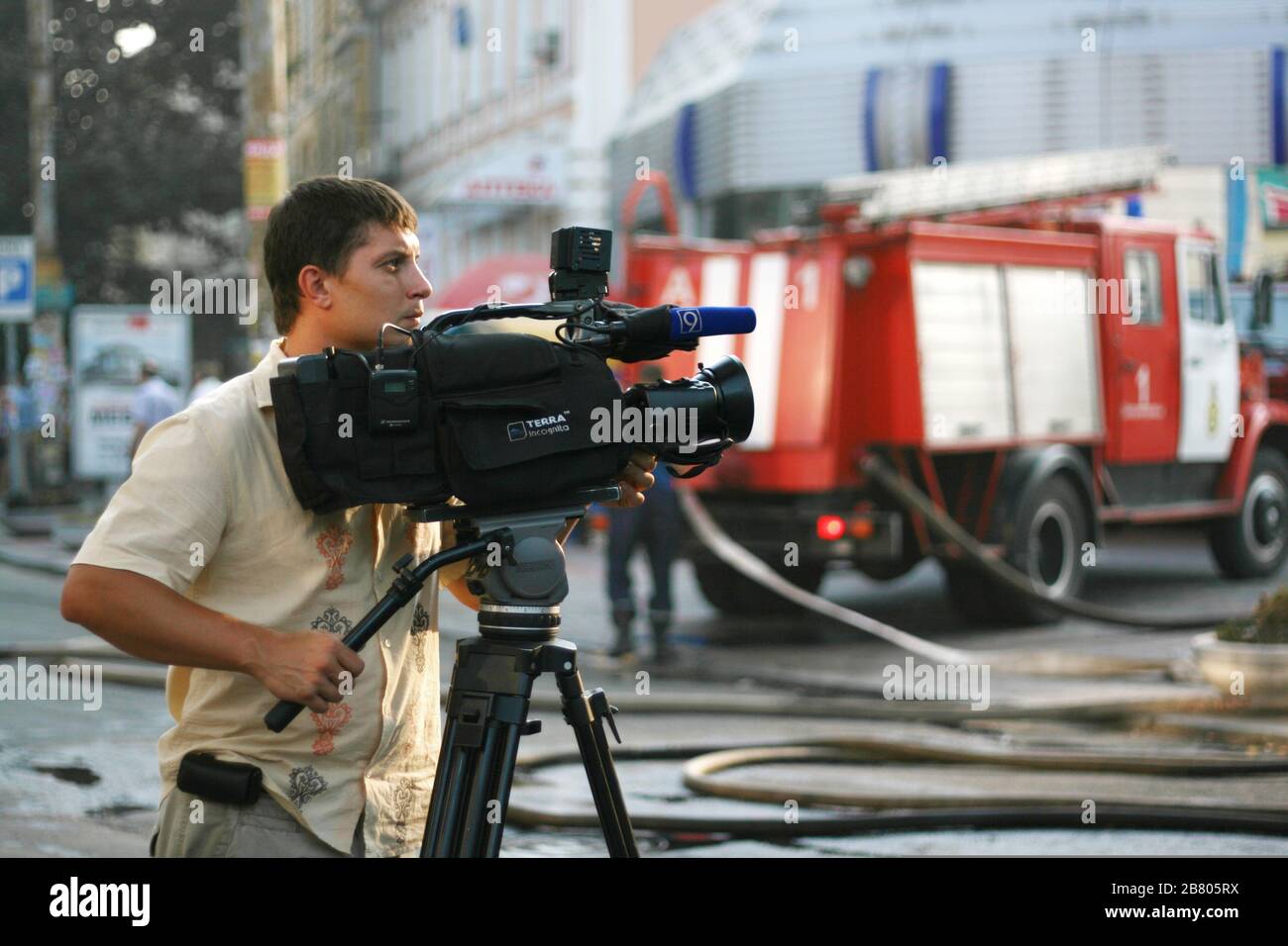 The reporter reports on the fire in the building from the scene Stock ...