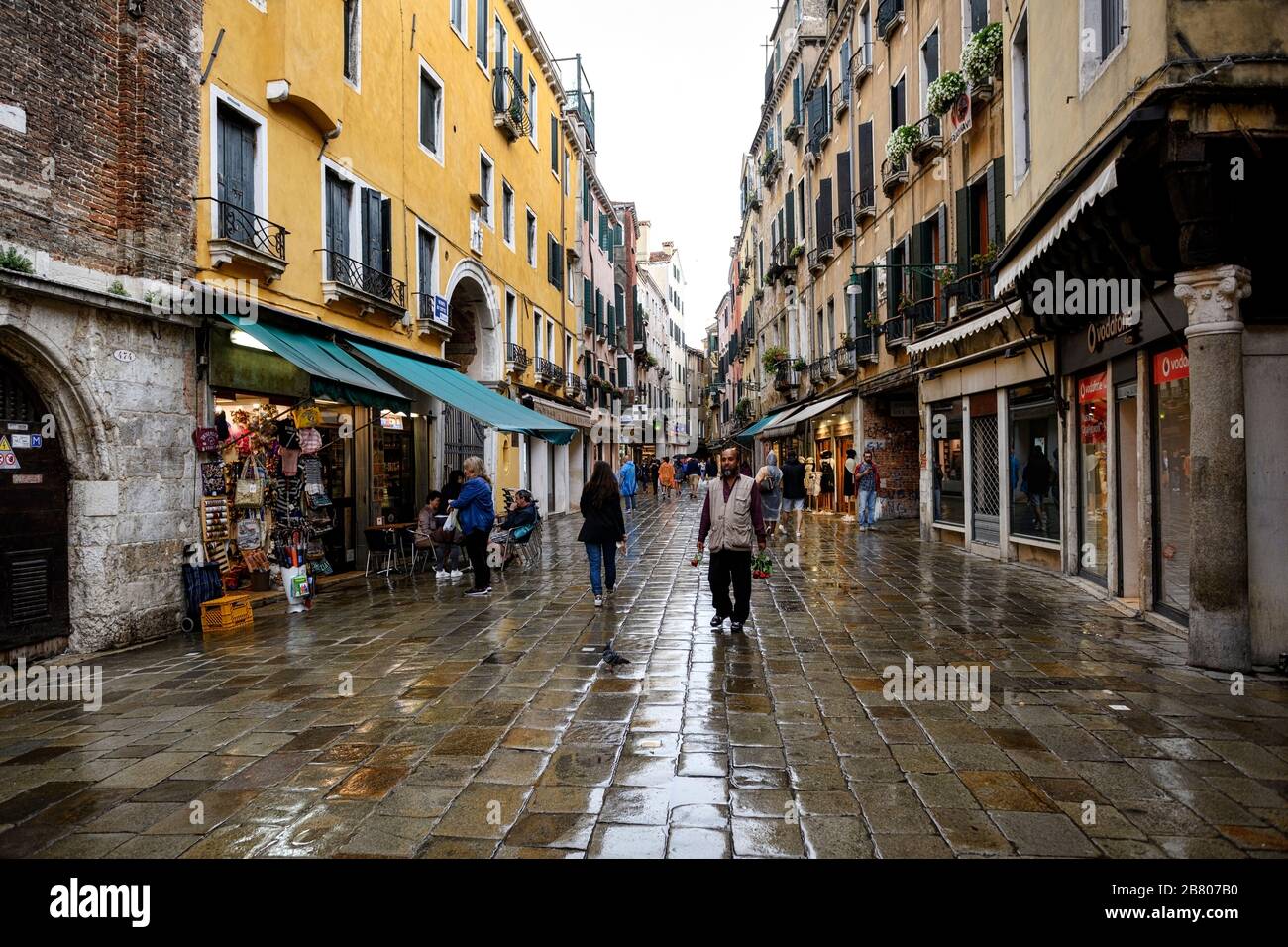 People on one of the streets Venice after a rainy day Stock Photo - Alamy