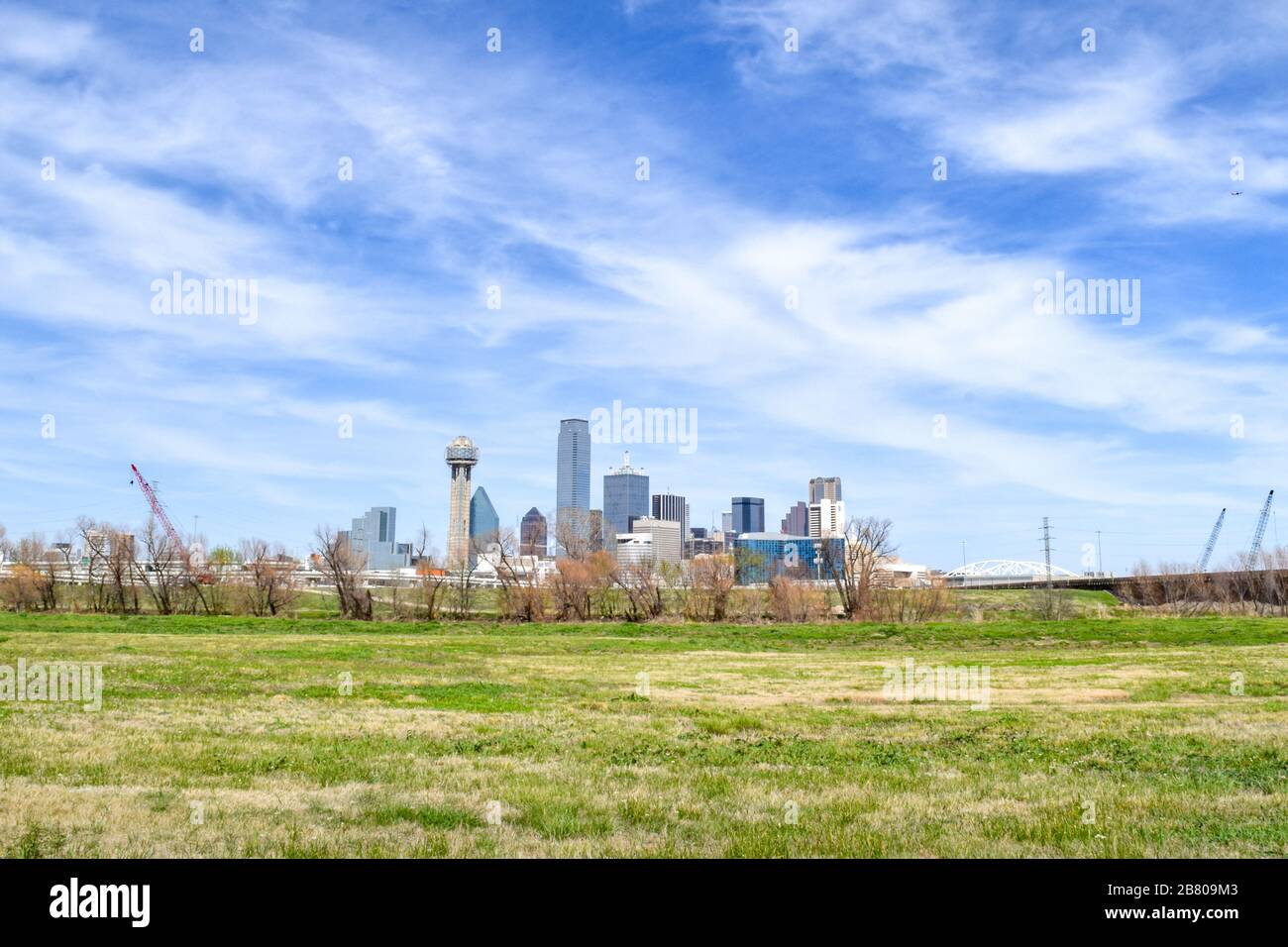 Skyline of Downtown Dallas and Expansive Green Meadow in Foreground ...