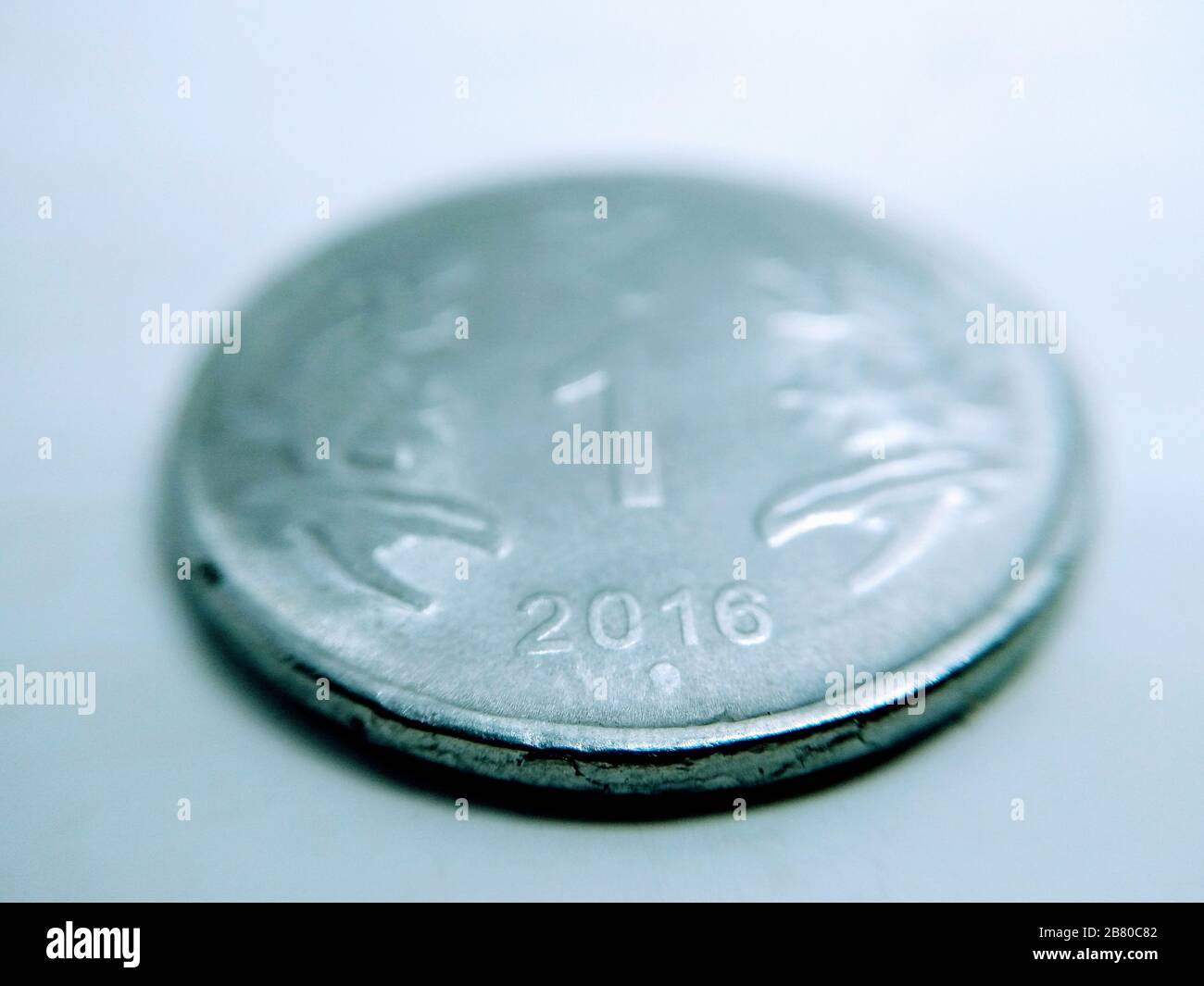 A picture of coin with white background Stock Photo - Alamy