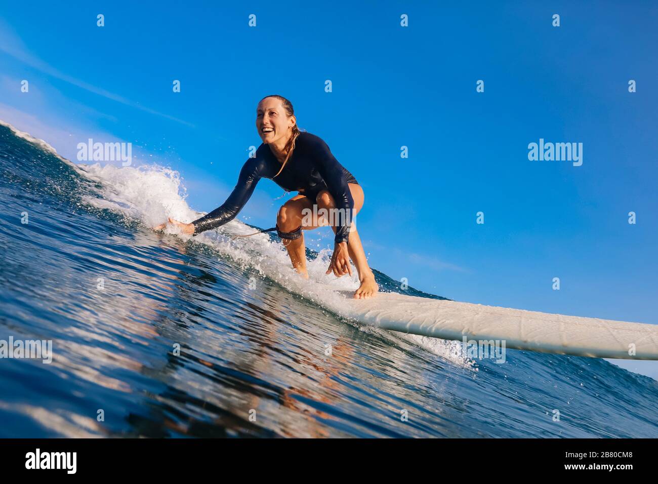 Female surfer wetsuit hi-res stock photography and images - Alamy