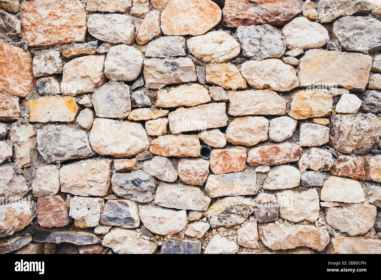 Wall of large natural stones, natural background. Great for design and ...