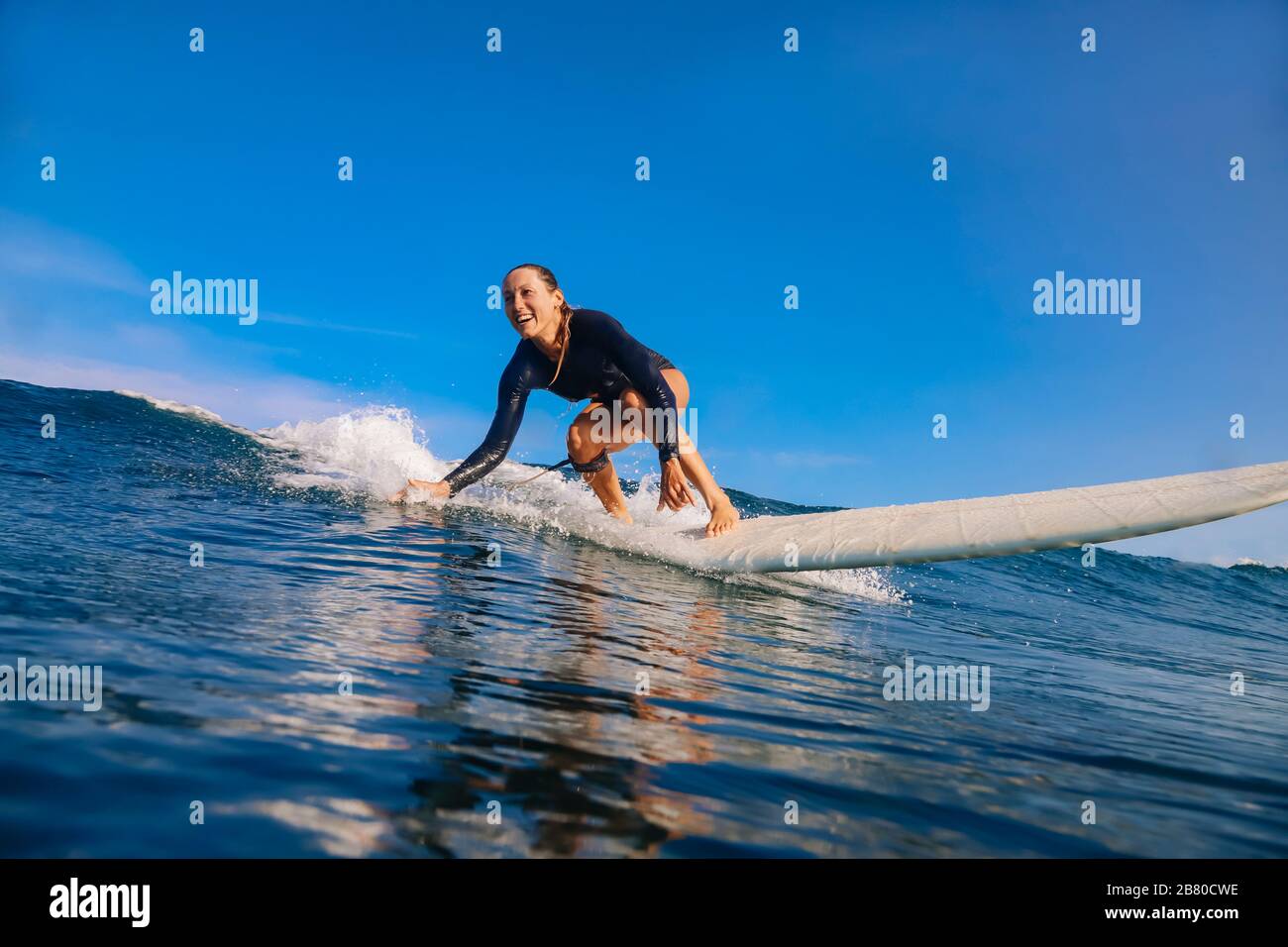 Female surfing wave hi-res stock photography and images - Alamy