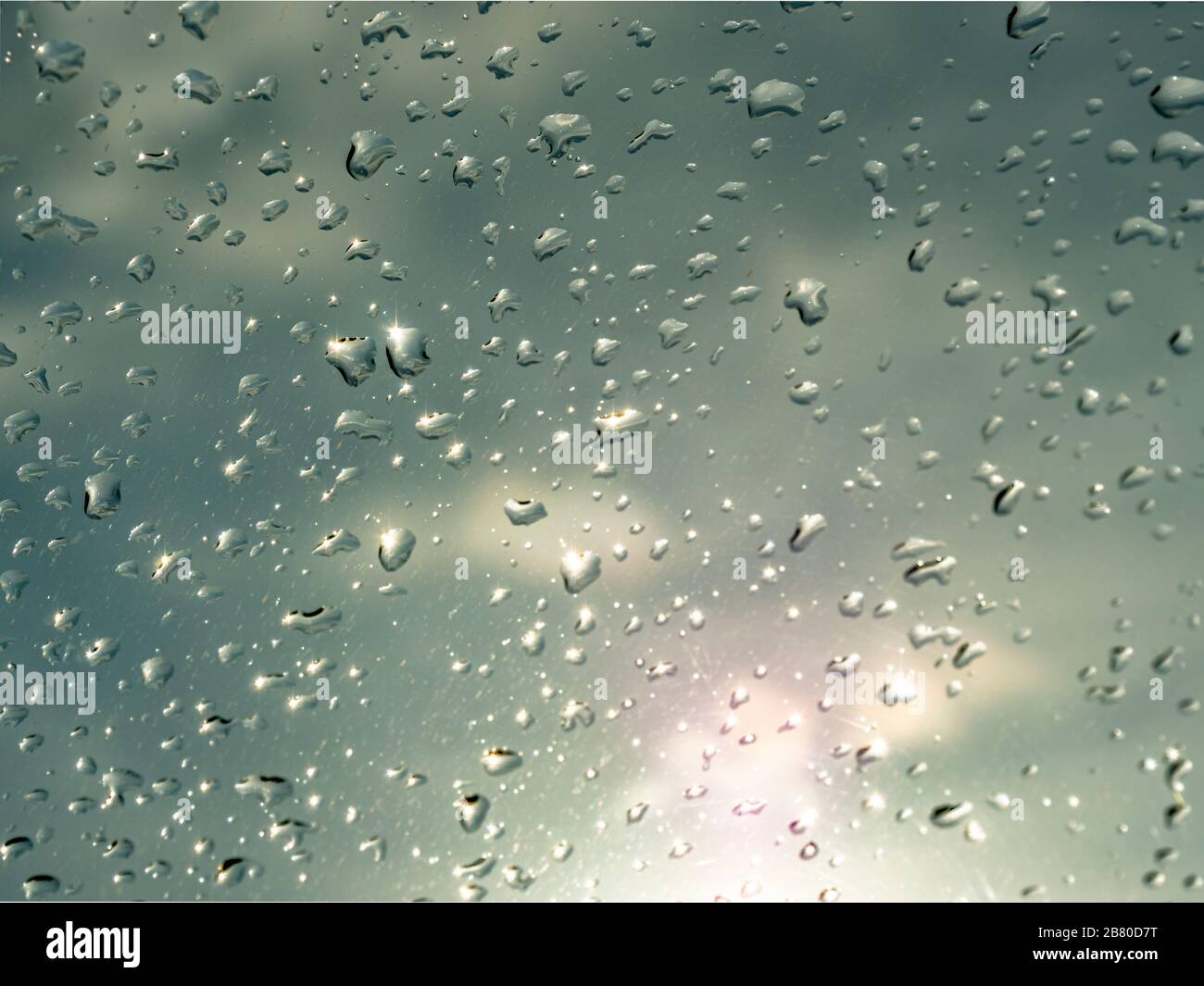 Wet window with rain drops and a cloudy sky outside background Stock ...