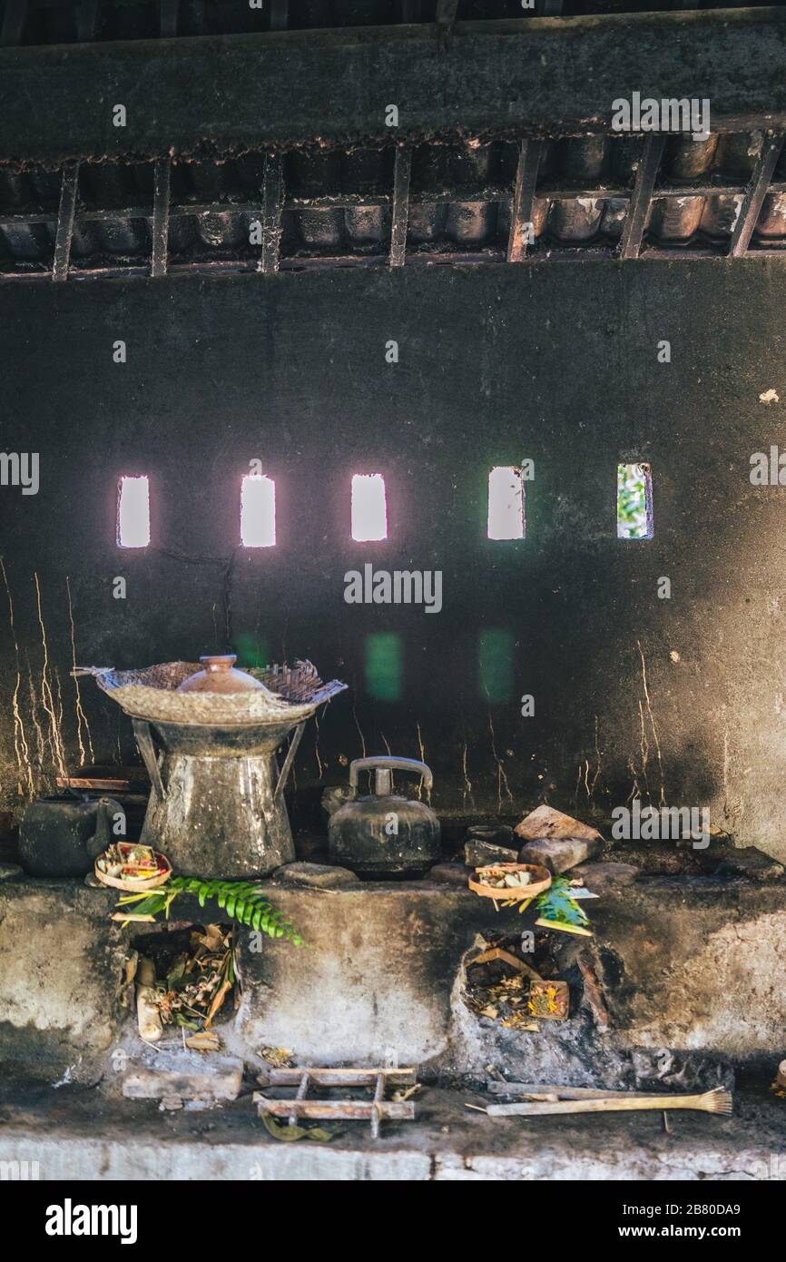 Vertical shot of a sooty dirty kitchen with traditional firewood ...