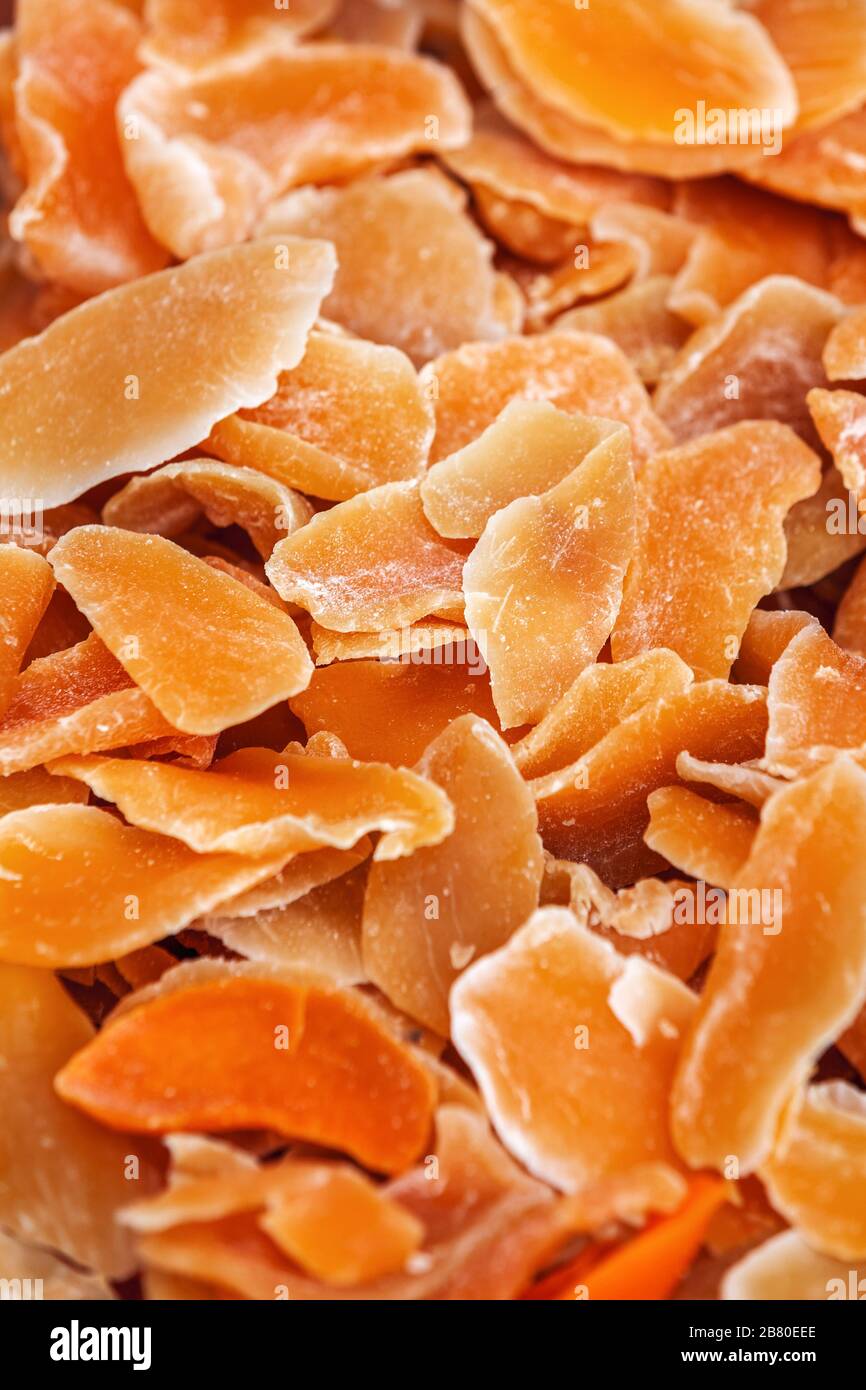 Dried mango background. Candied slices of mango fruit Stock Photo - Alamy
