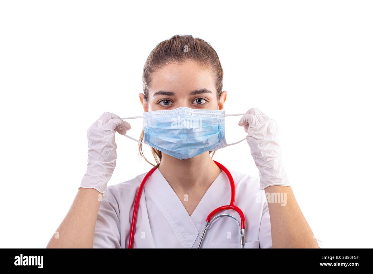 Woman puts on a protective mask. Personal protective equipment against ...