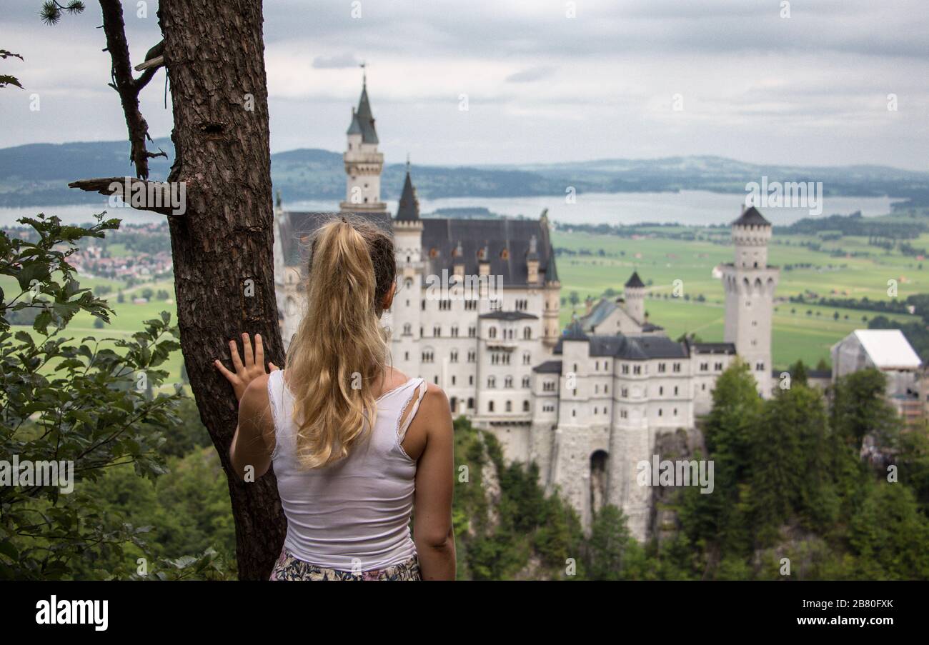 Person brunette girl view to Neuschwanstein castle great mood Stock ...