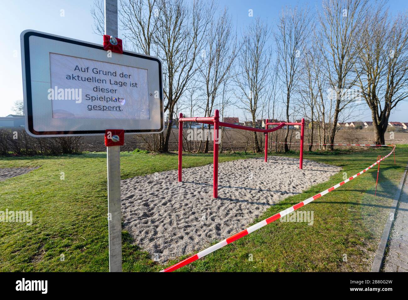 Prohibition sign and red and white barrier tape at a locked children's ...