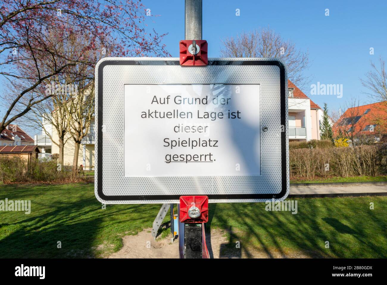 Prohibition sign and red and white barrier tape at a locked children's ...
