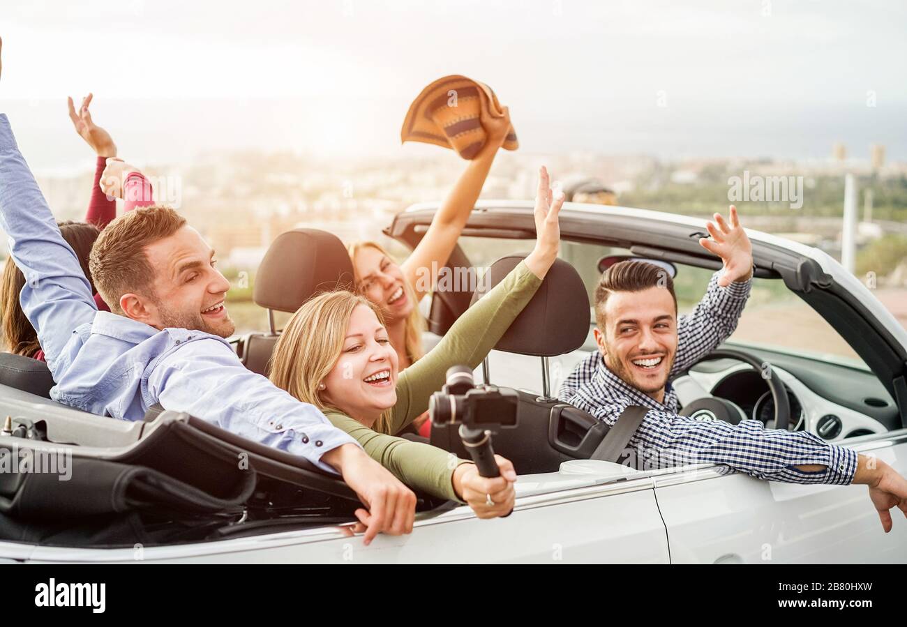 Happy friends making video with action camera gimbal - Trendy people ...