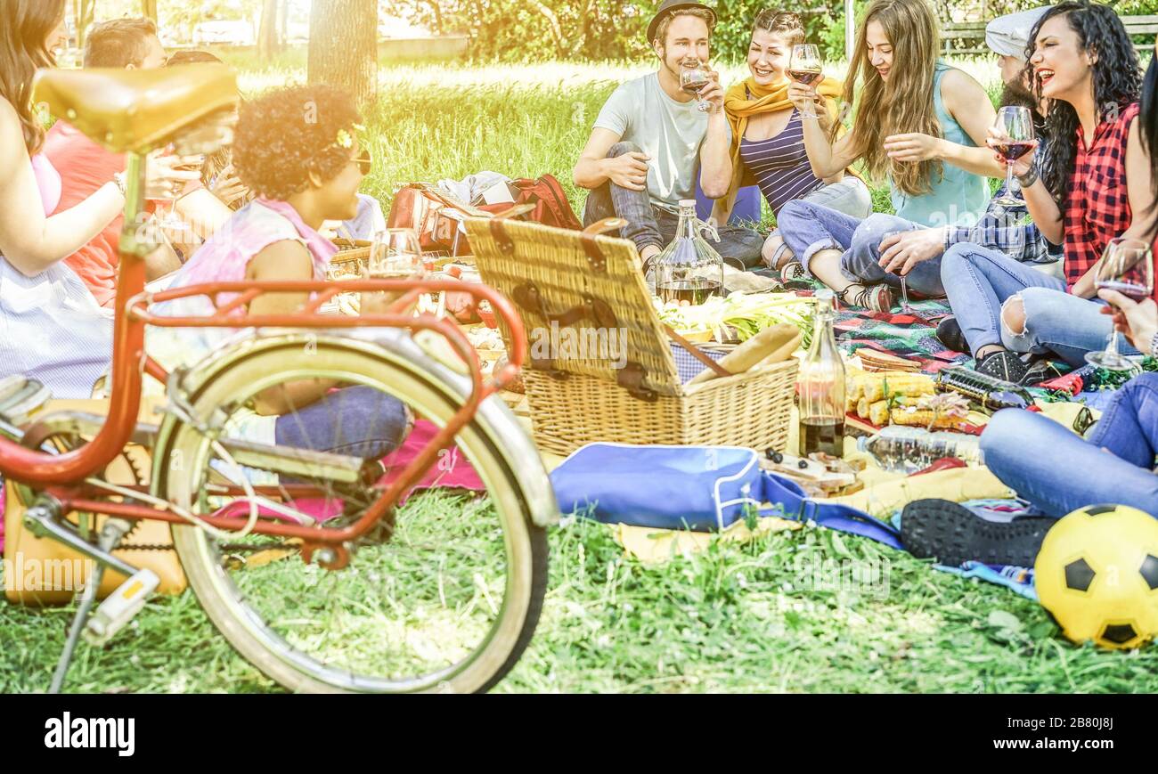 Diverse culture friends making picnic on city park outdoor - Young ...