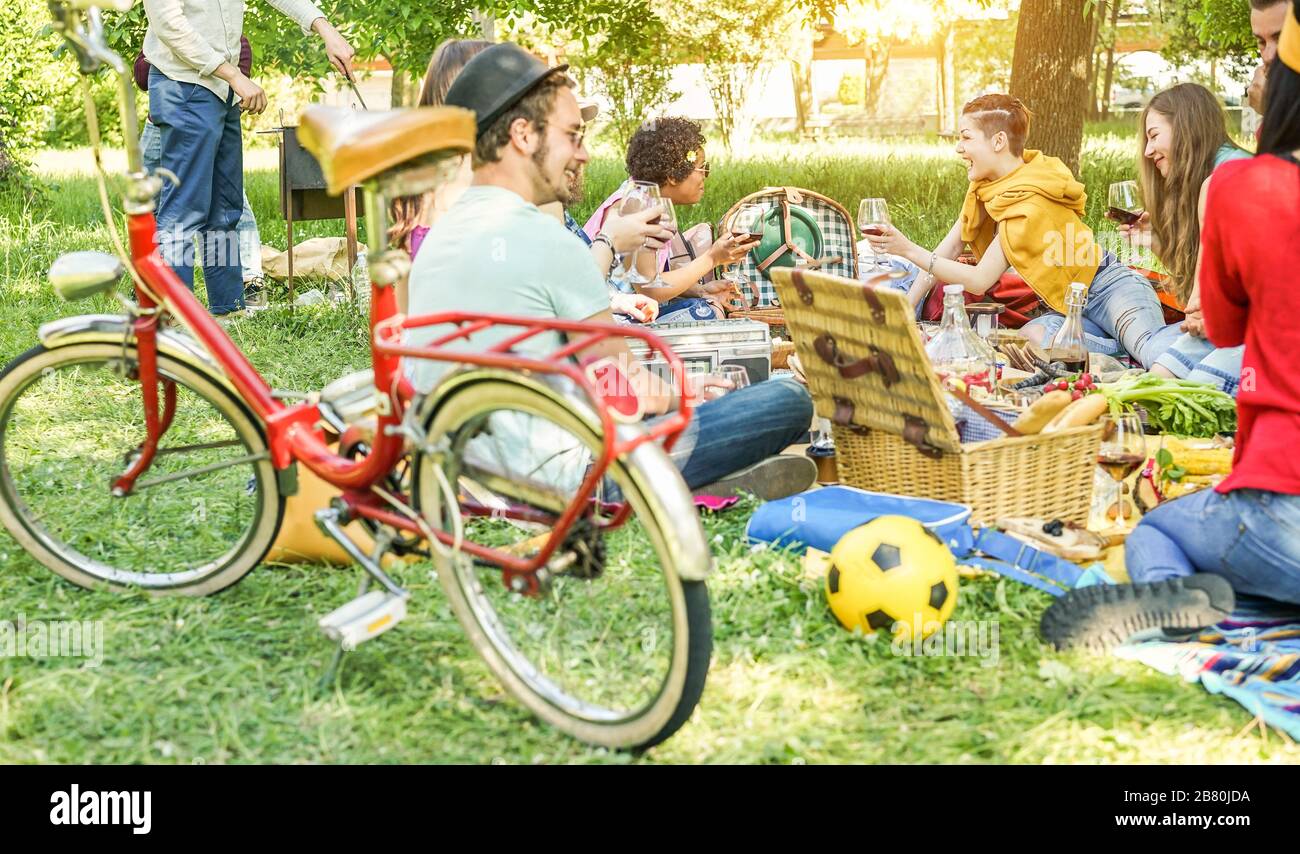 Happy friends making picnic on city park outdoor - Young trendy people ...