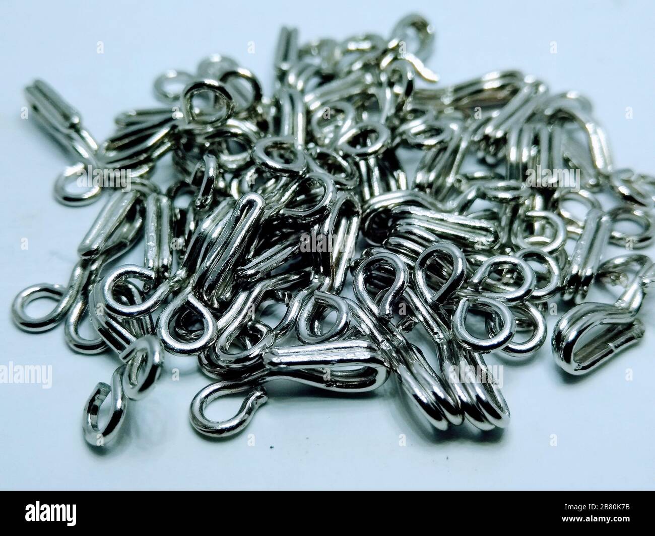 A picture of cloth hooks Stock Photo - Alamy