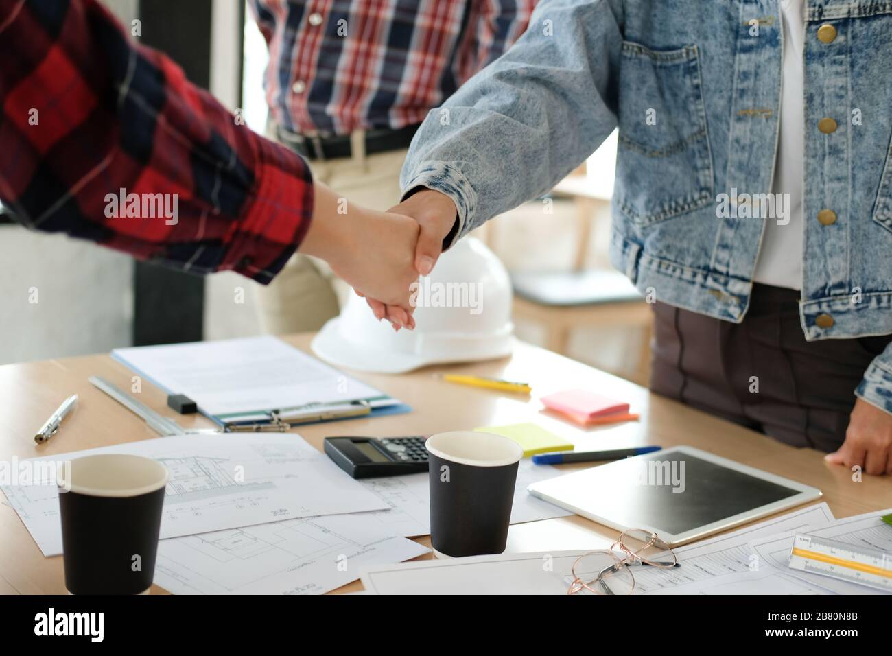 engineer team handshaking. architect shaking hands for successful deal ...