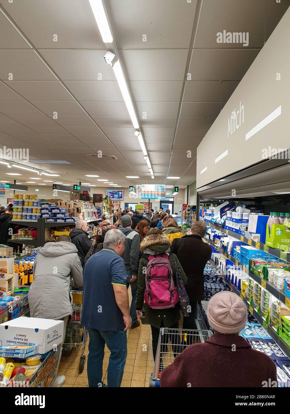 Munich, Germany, 14 of april 2020: huge queue in front of the checkout ...