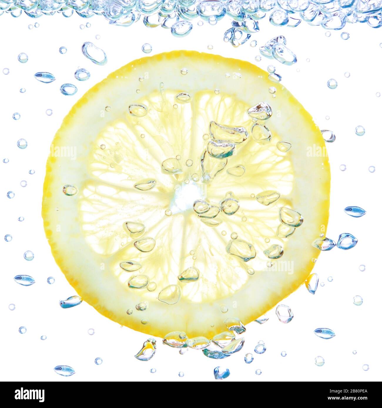 Lemon in a liquid with bubbles. On a white background Stock Photo - Alamy