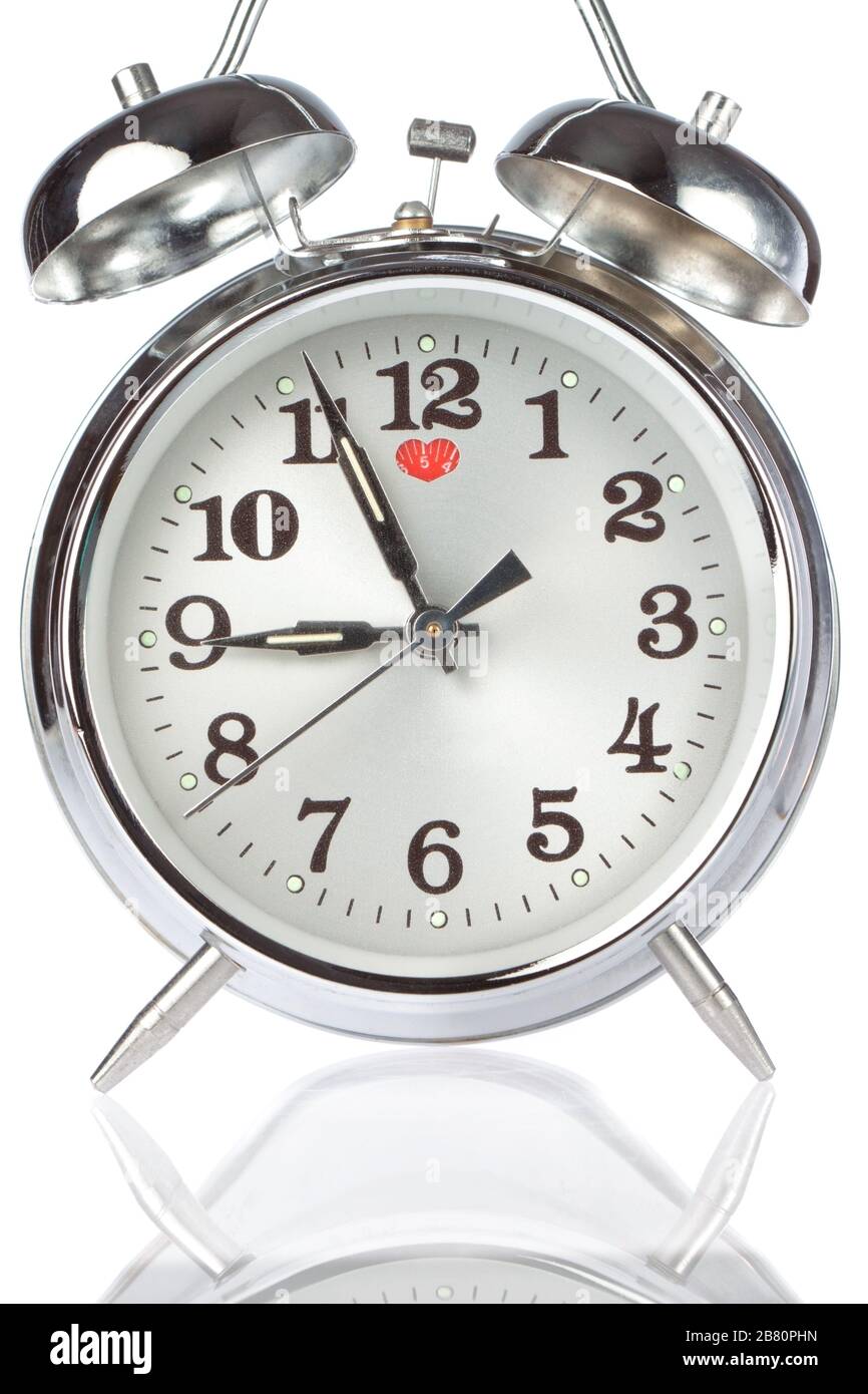 Silver Alarm Clock closeup Stock Photo - Alamy