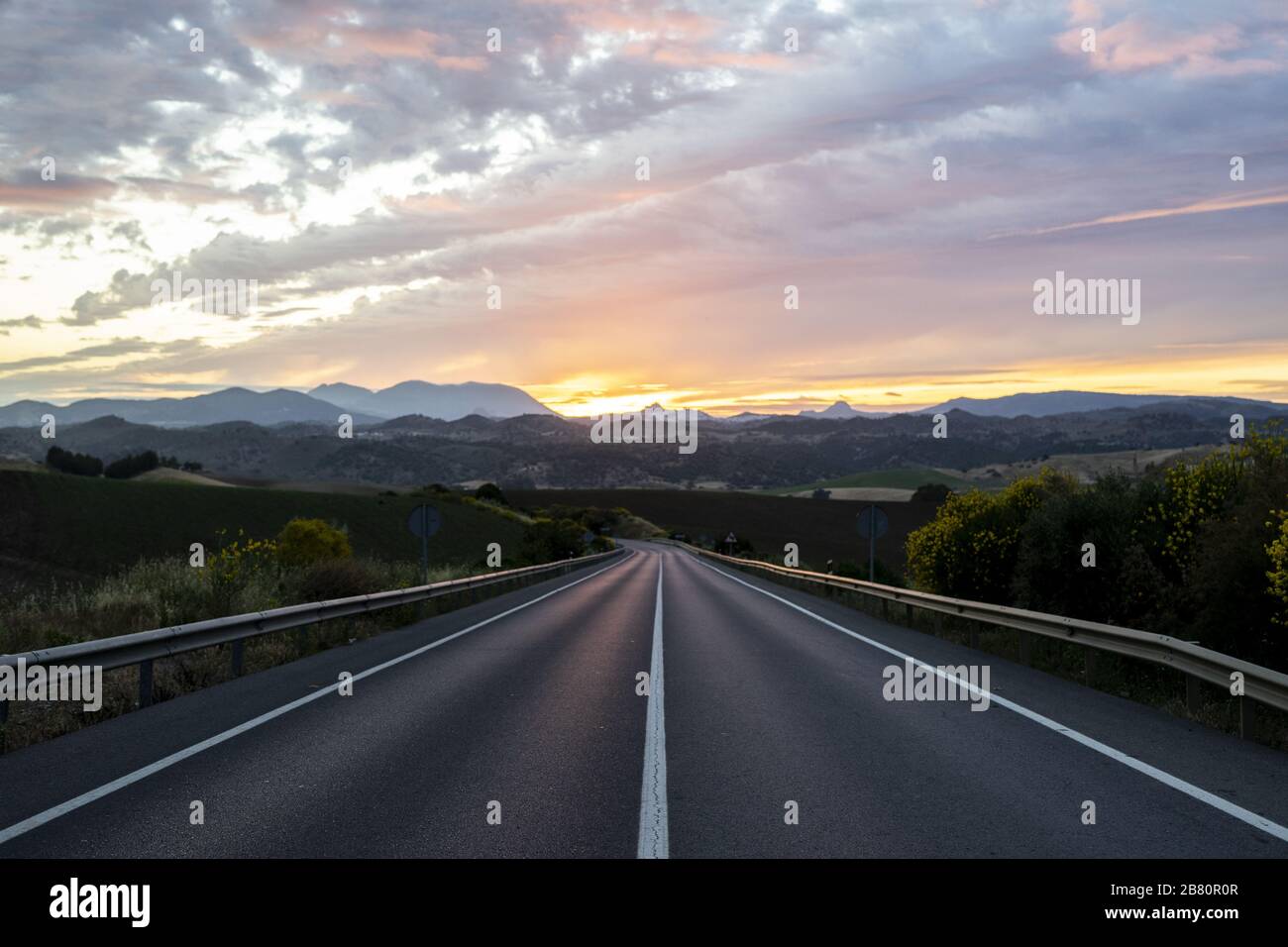 Empty highway surrounded hills hi-res stock photography and images - Alamy